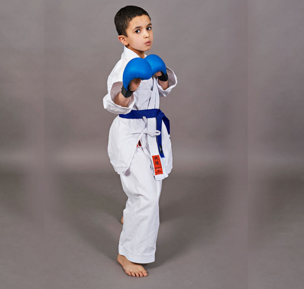 Karate involves dynamic movements, enhancing a child's physical fitness ...