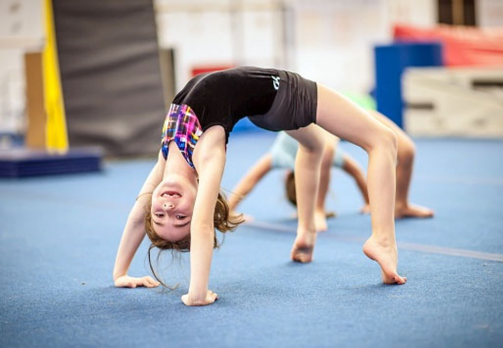 How to do a Bridge While Lying on Their Back in Gymnastics | Fit Box ...